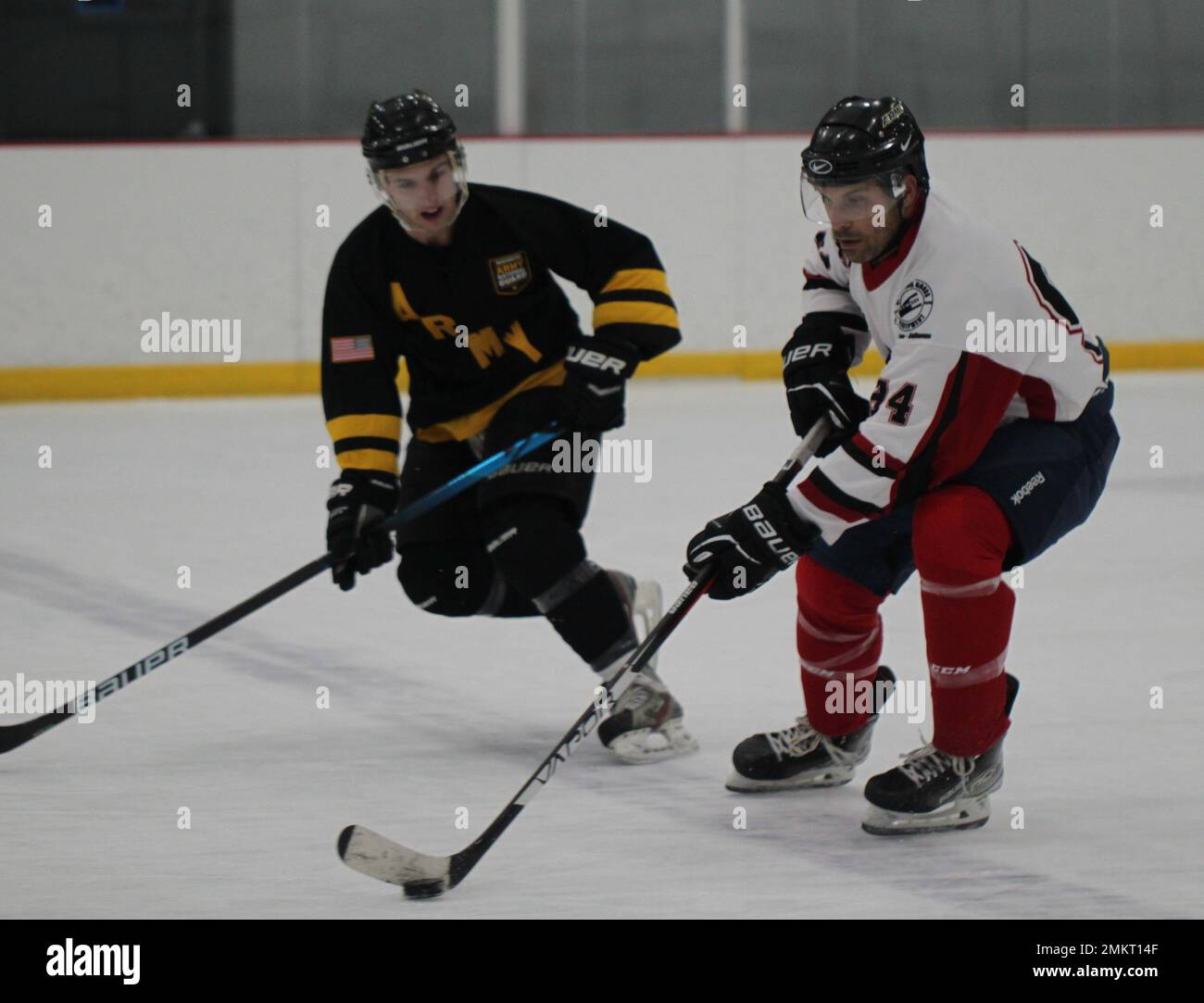 Chris Garceau, right, breaks down the ice as Ben Ihrie gives chase ...