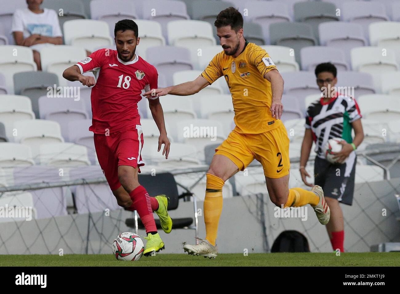 Jordan's midfielder Musa Al-Taamari, left, fights for the ball with ...