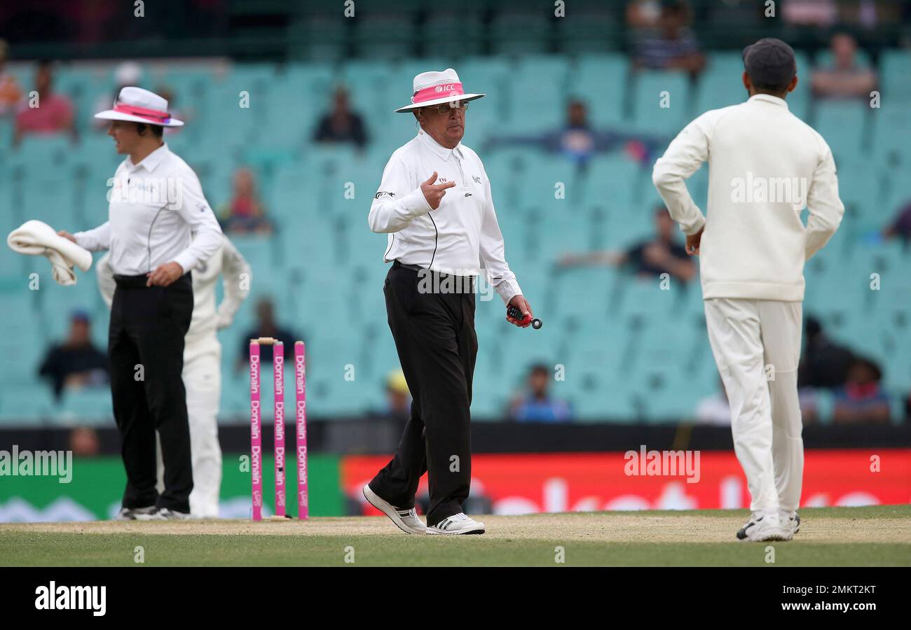Umpire Ian Gould, center, signals to India's Virhat Kohli, right, that ...