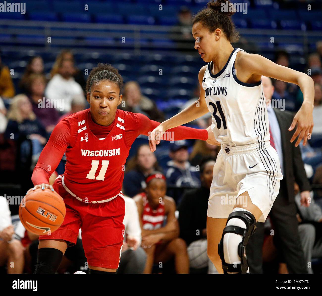 Wisconsin's Marsha Howard (11) drives on Penn State's Jaida Travascio ...