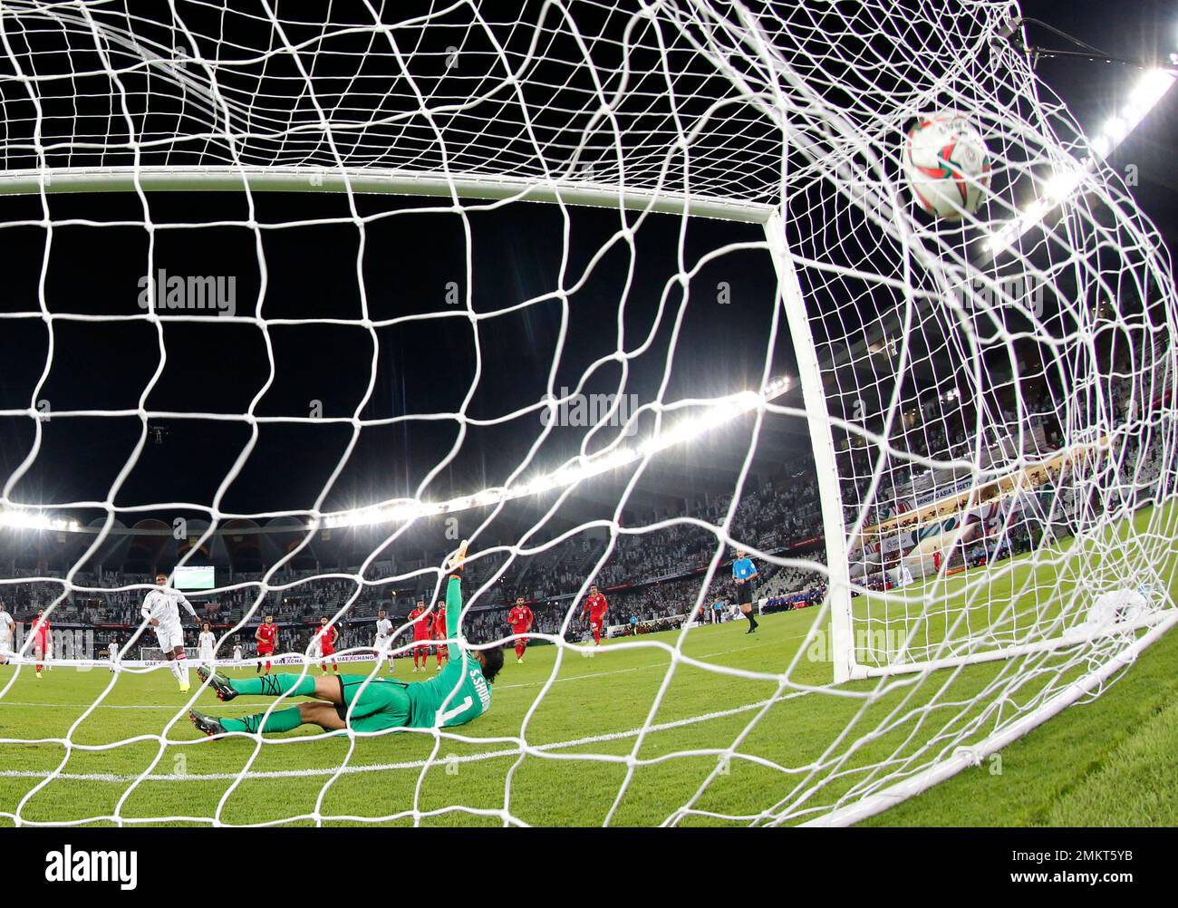 Bahrain's goalkeeper Said Ebrahim dives but fails to stop a penalty ...