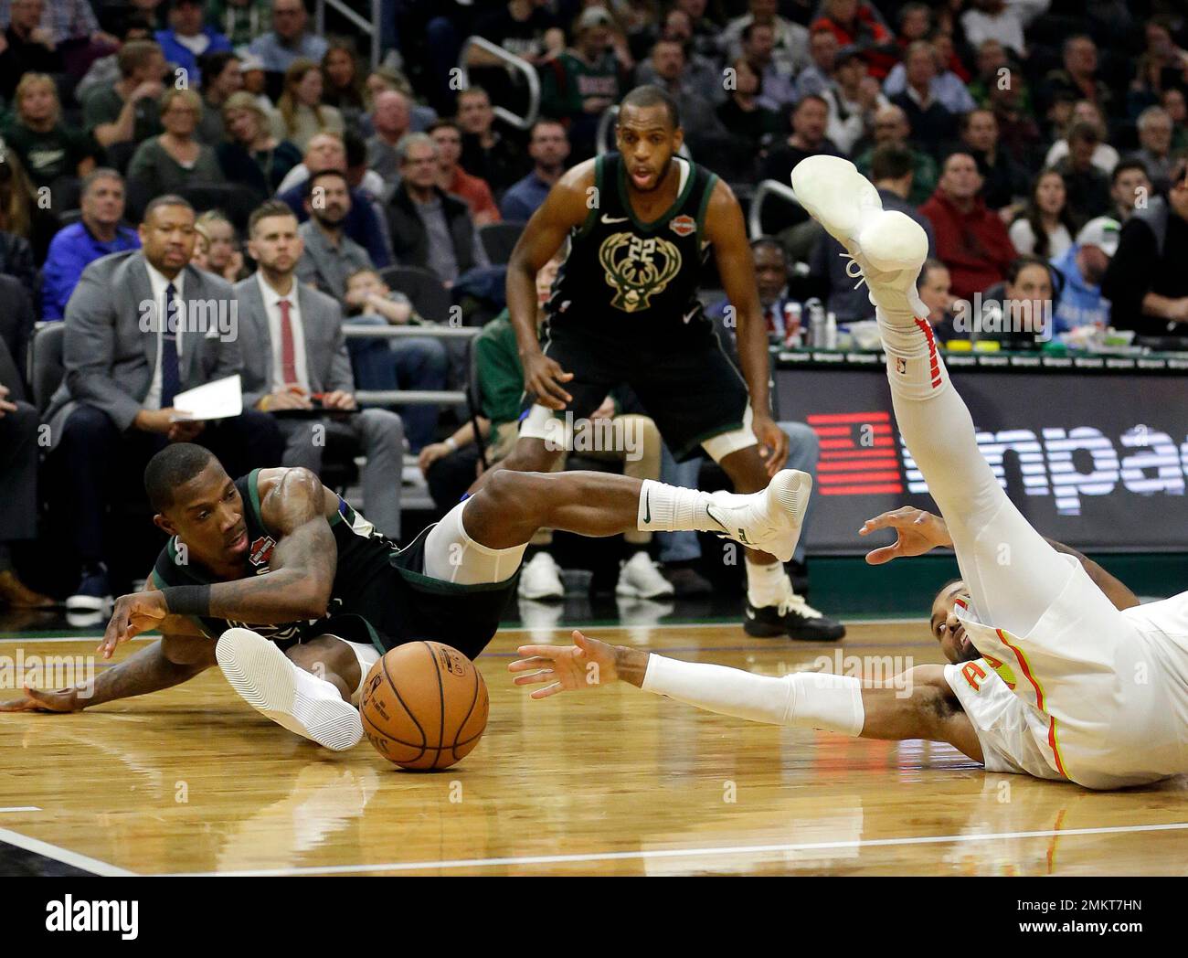 Milwaukee Bucks' Eric Bledsoe, left, and Atlanta Hawks' DeAndre' Bembry ...