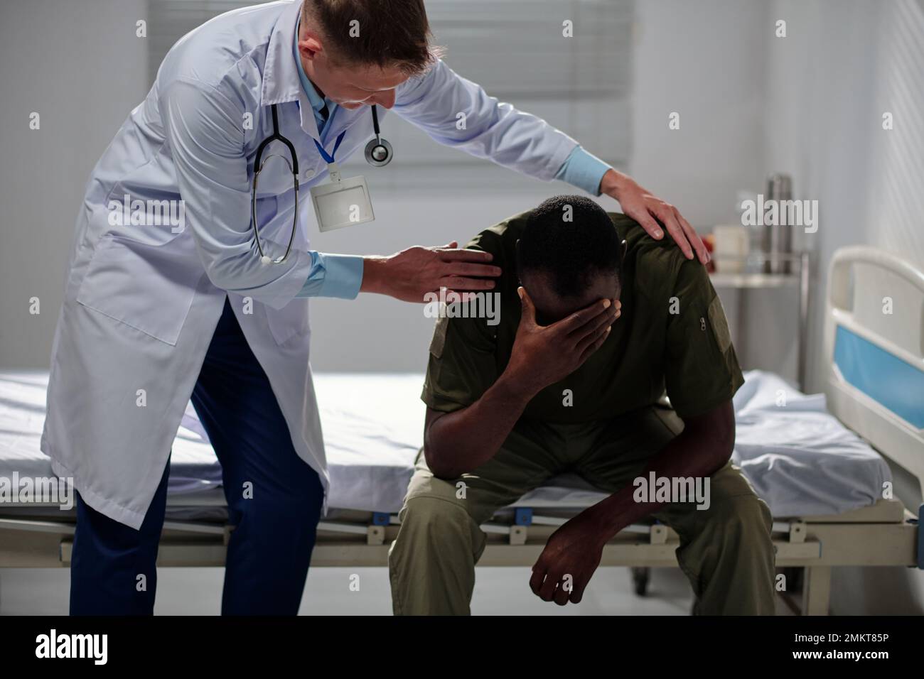 Psychologist reassuring crying military man suffering from ptsd Stock ...