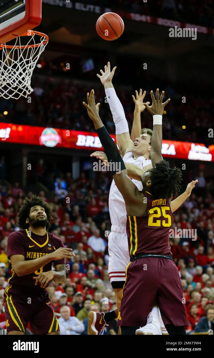 Wisconsin's Ethan Happ (22) against Minnesota's Jordan Murphy (3) and ...