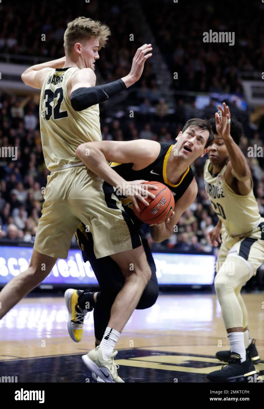 Iowa forward Ryan Kriener (15) looks to shoot around Purdue center Matt ...