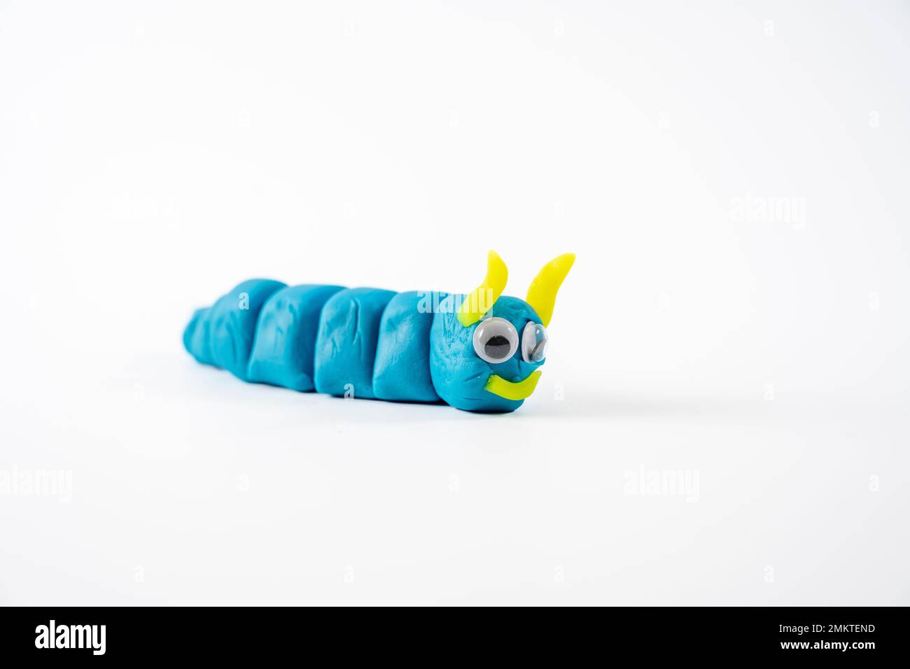 selected focus on head and antenna plasticine play dough wriggly worm ...