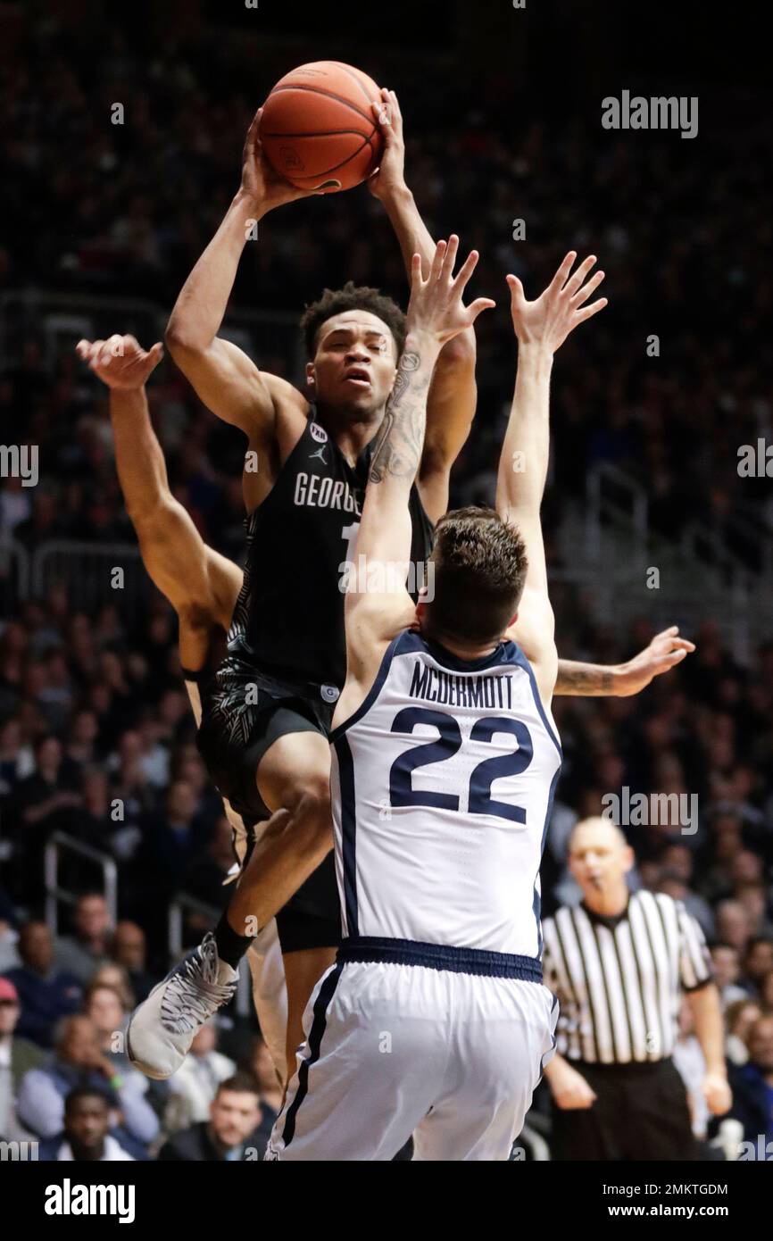 Butler forward Sean McDermott (22) draws the fouls from Georgetown ...