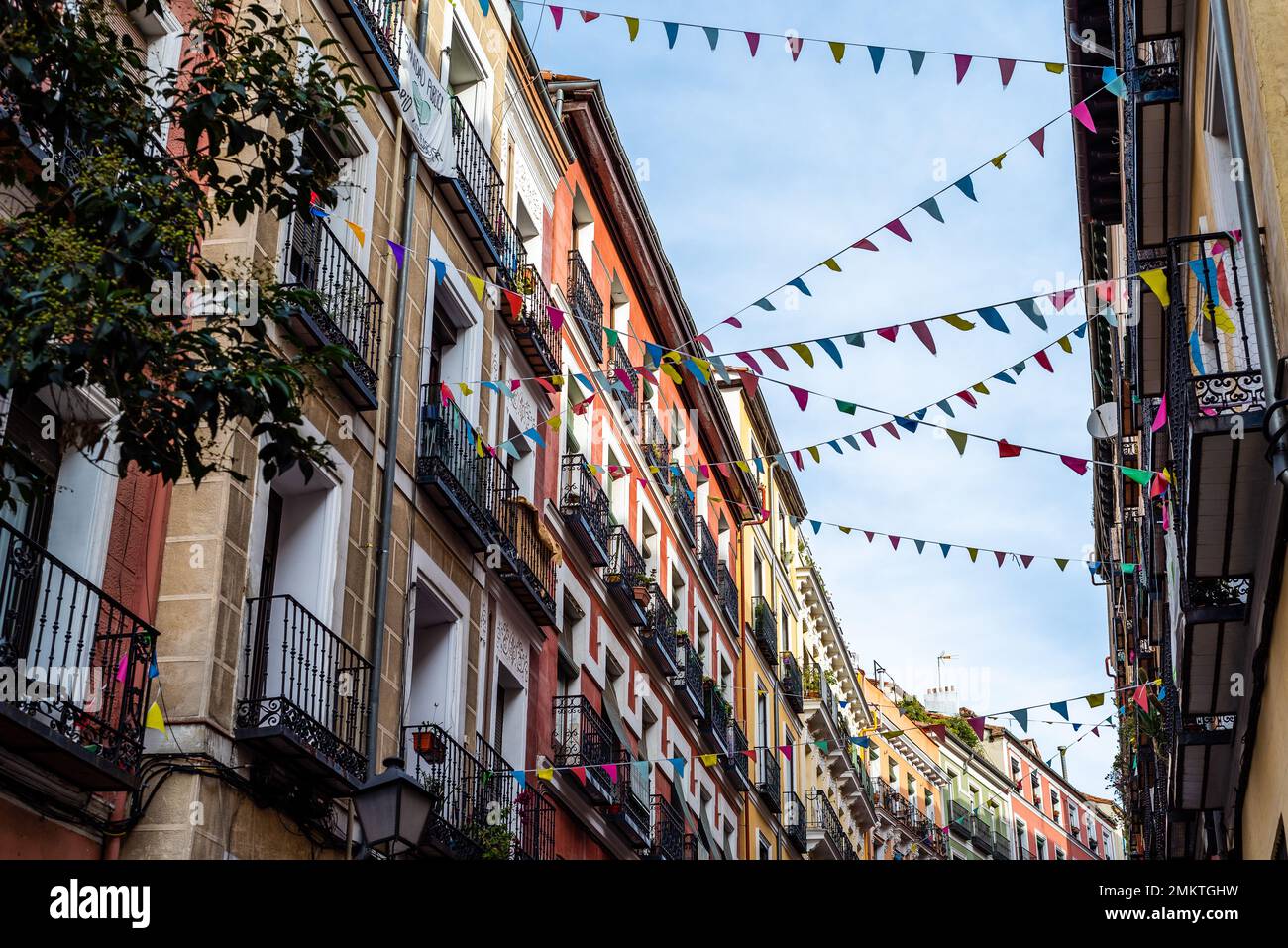 Street decorated with pennants hanging from the facades in the ...