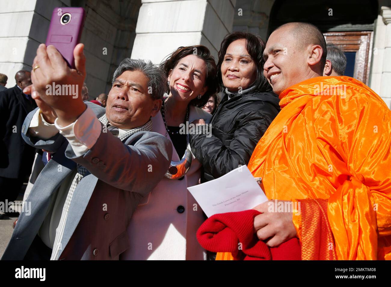 Rhode Island Gov. Gina Raimondo, second from left, poses for a selfie ...