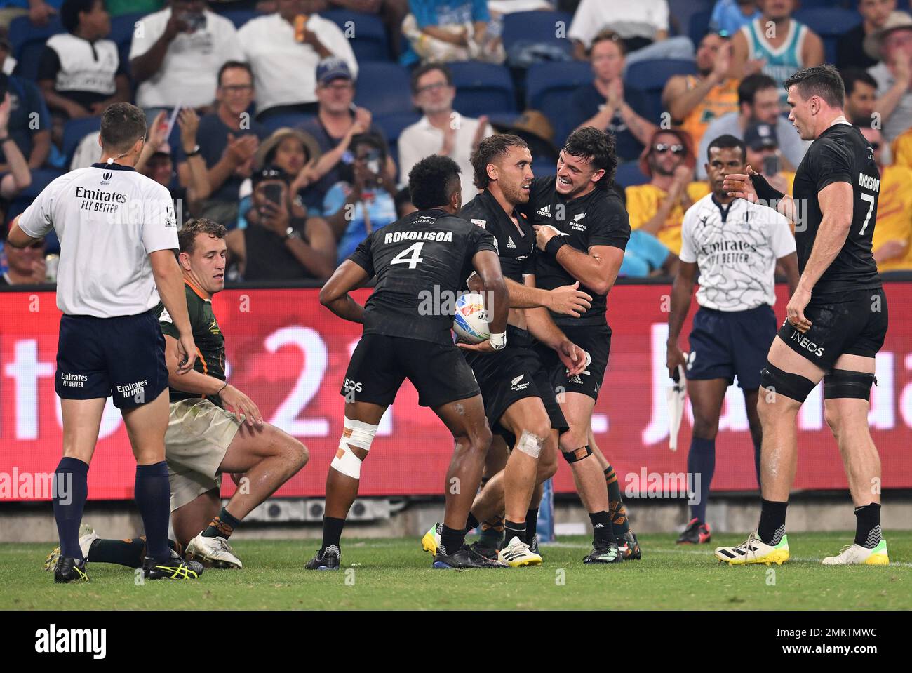 Joe Webber of New Zealand (centre) after scoring a try during the HSBC ...
