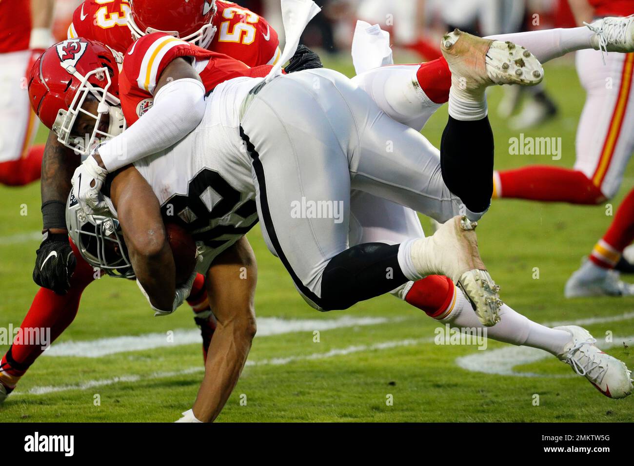 Oakland Raiders running back Doug Martin (28) is tackled by Kansas City ...