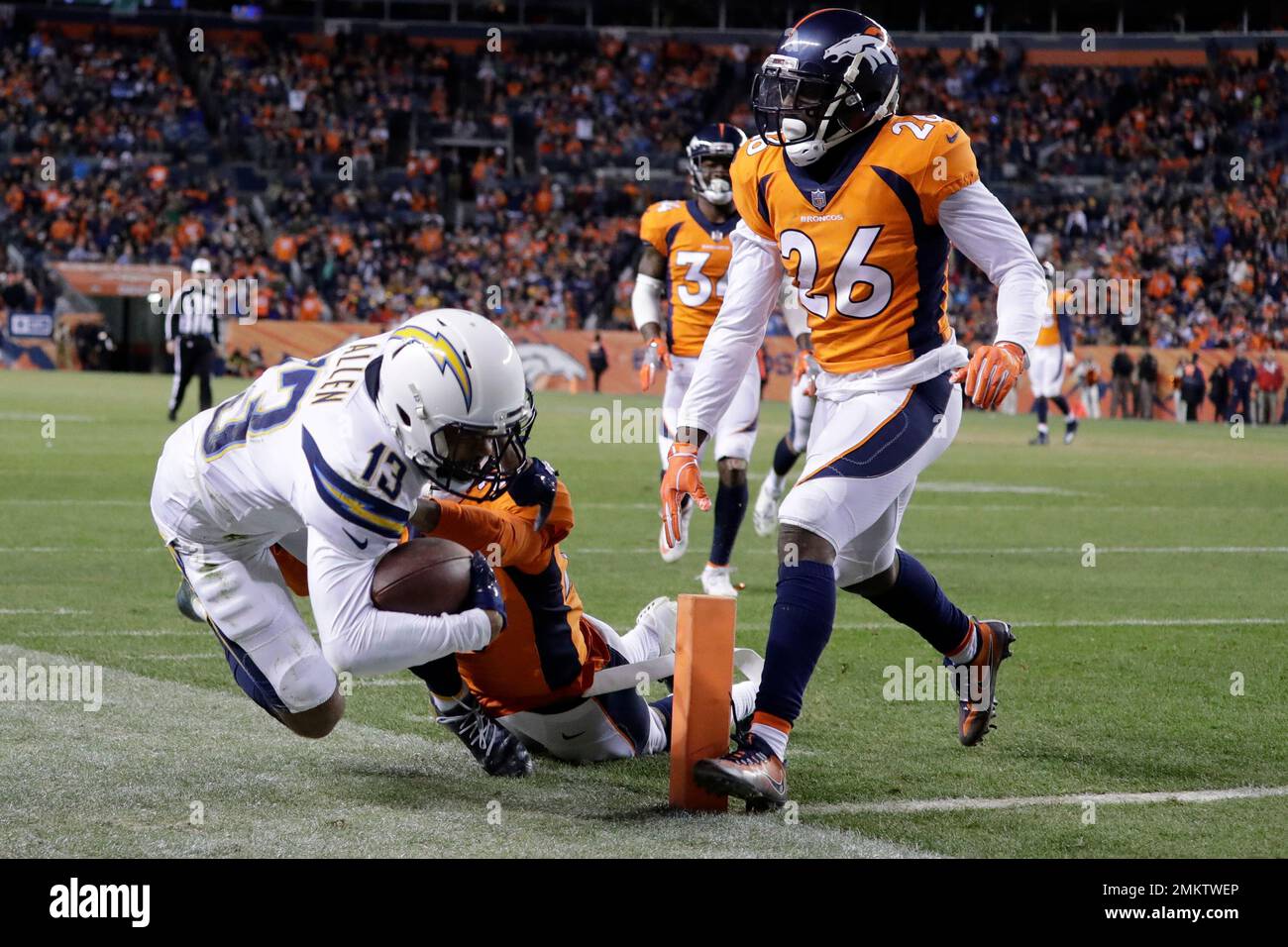 Los Angeles Chargers wide receiver Keenan Allen, left, gets the ball in ...