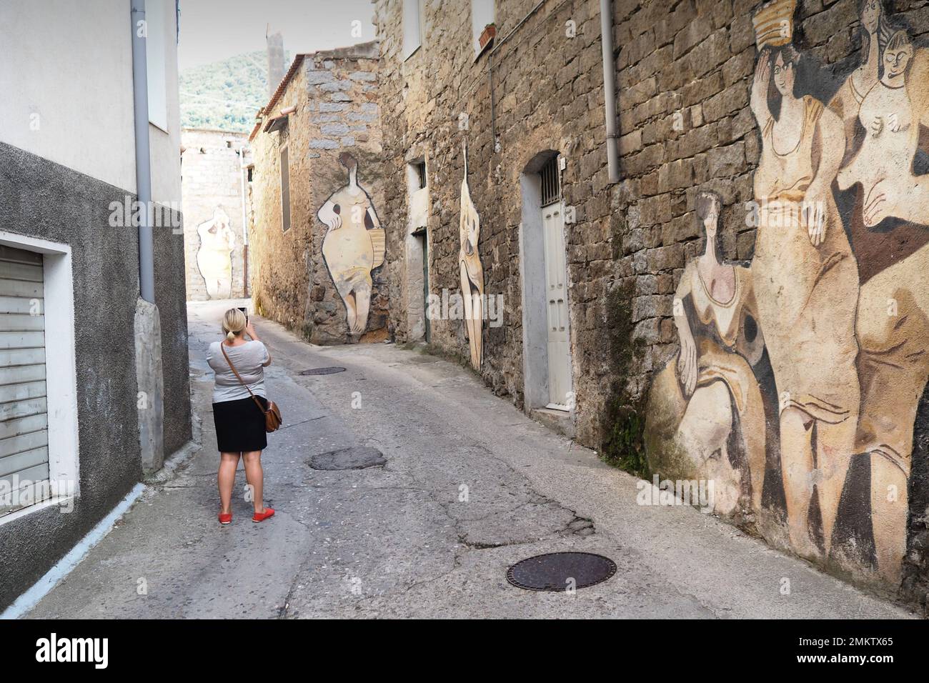 tourist in the town of Orgosolo, Sardinia region, Italy. Orgosolo is ...