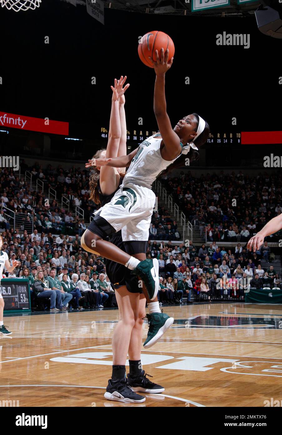 Michigan State's Nia Clouden, right, shoots and draws a foul against ...