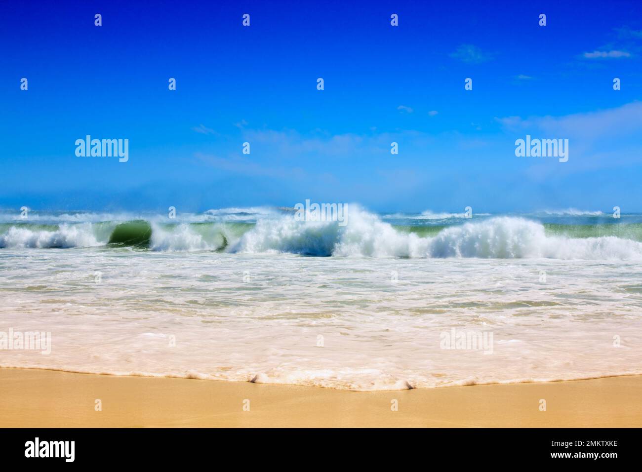 Strong waves crash over the beach Stock Photo - Alamy