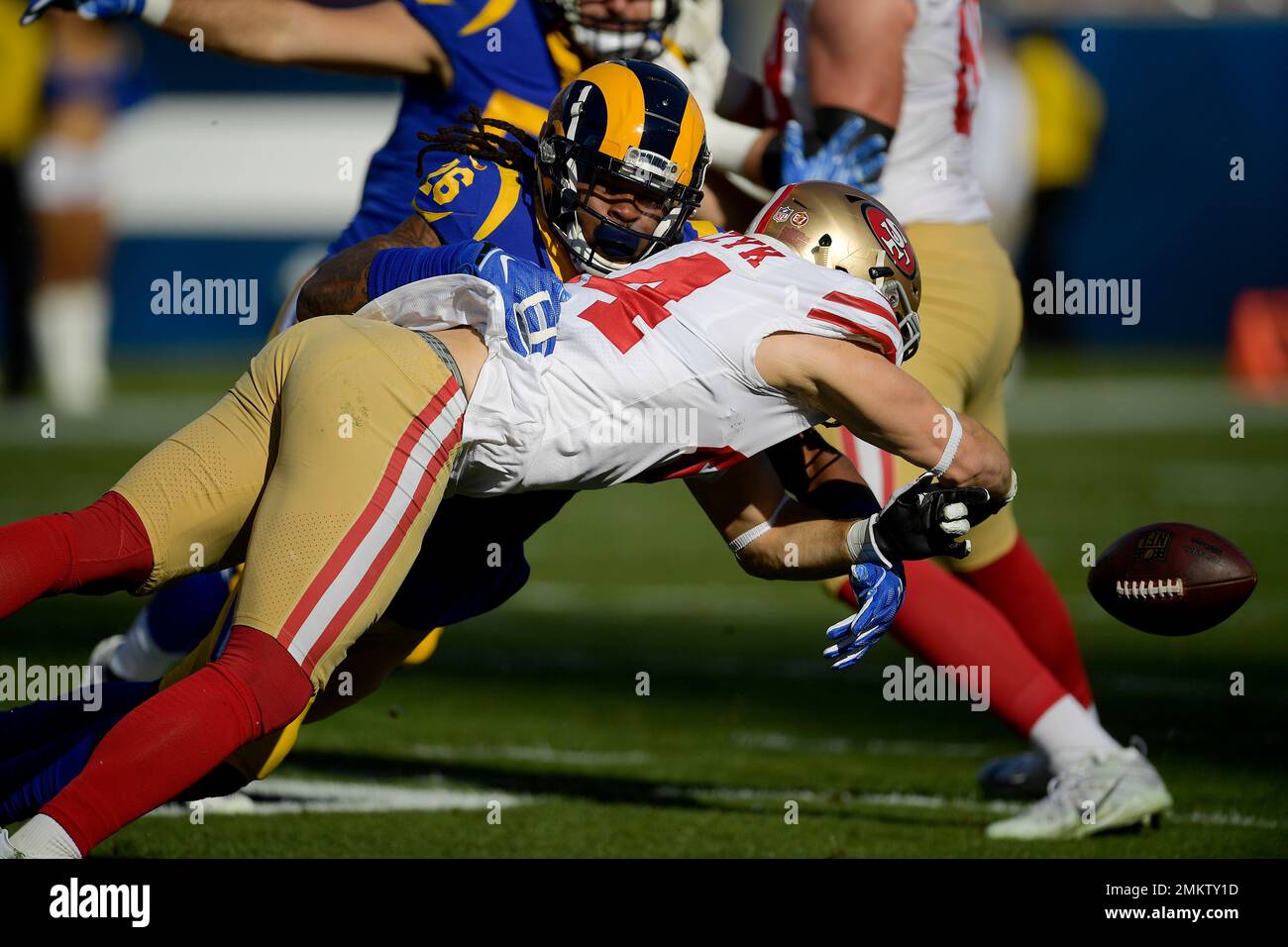 Los Angeles Rams inside linebacker Mark Barron, top, forces a fumble by ...