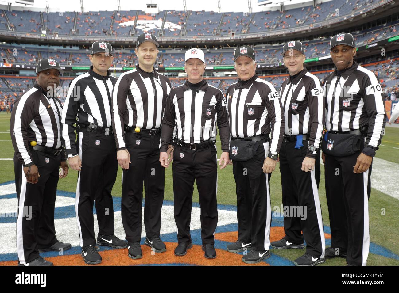 Officials pose before an NFL football game between the Los Angeles ...