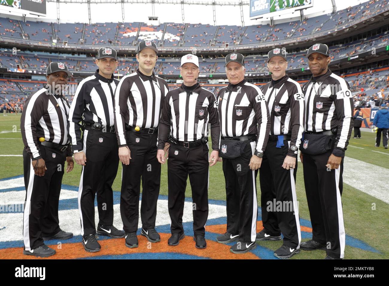 Officials pose before an NFL football game between the Los Angeles ...