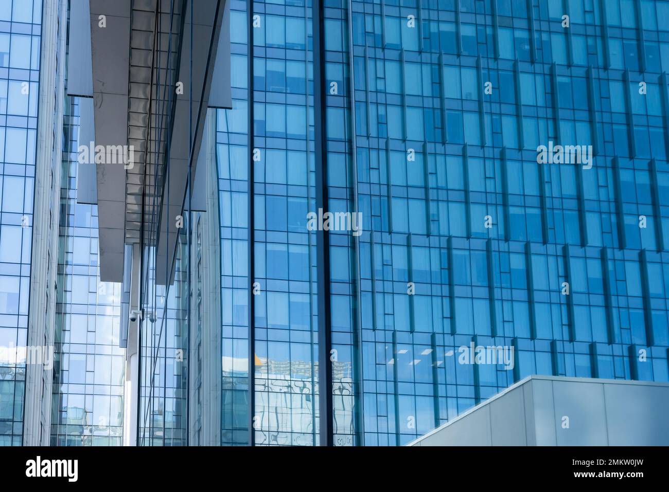 The geometry of modern urban architecture is reflected in the glass ...