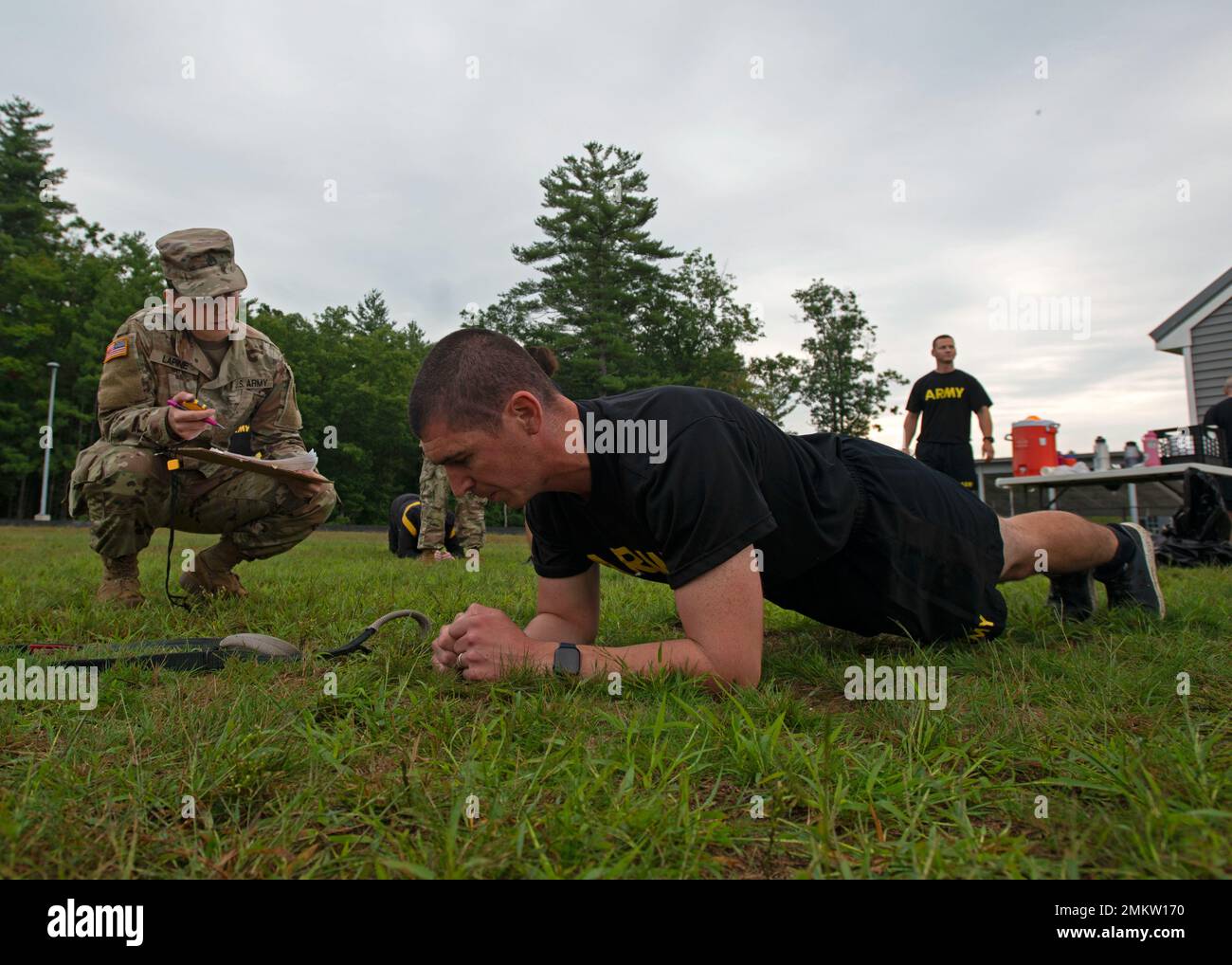 From left, Staff Sgt. Erin Lapine times Sgt. Matthew Komisarek during ...