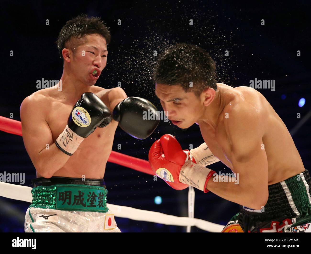 Japan's Takuma Inoue, left, sends a left to Thailand's Tasana Salapat ...