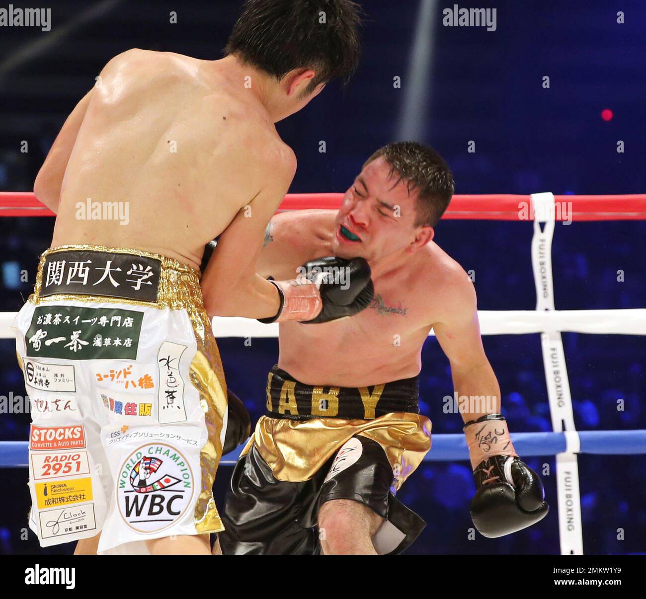 Japanese champion Ken Shiro, left, sends a right to Mexican challenger ...