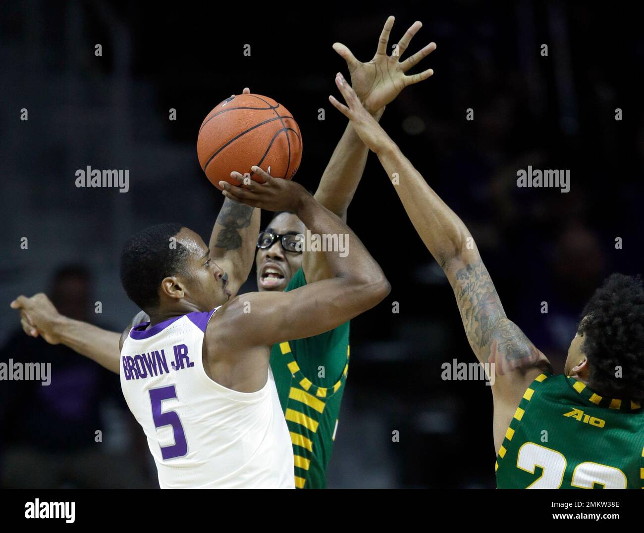 Kansas State guard Barry Brown Jr. (5) is fouled by George Mason ...