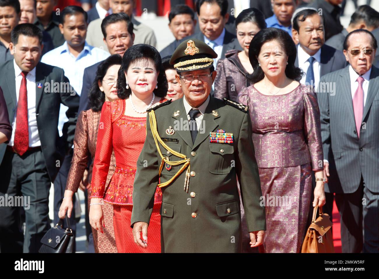 Cambodia's Prime Minister Hun Sen, center, and his wife Bunrany, center ...