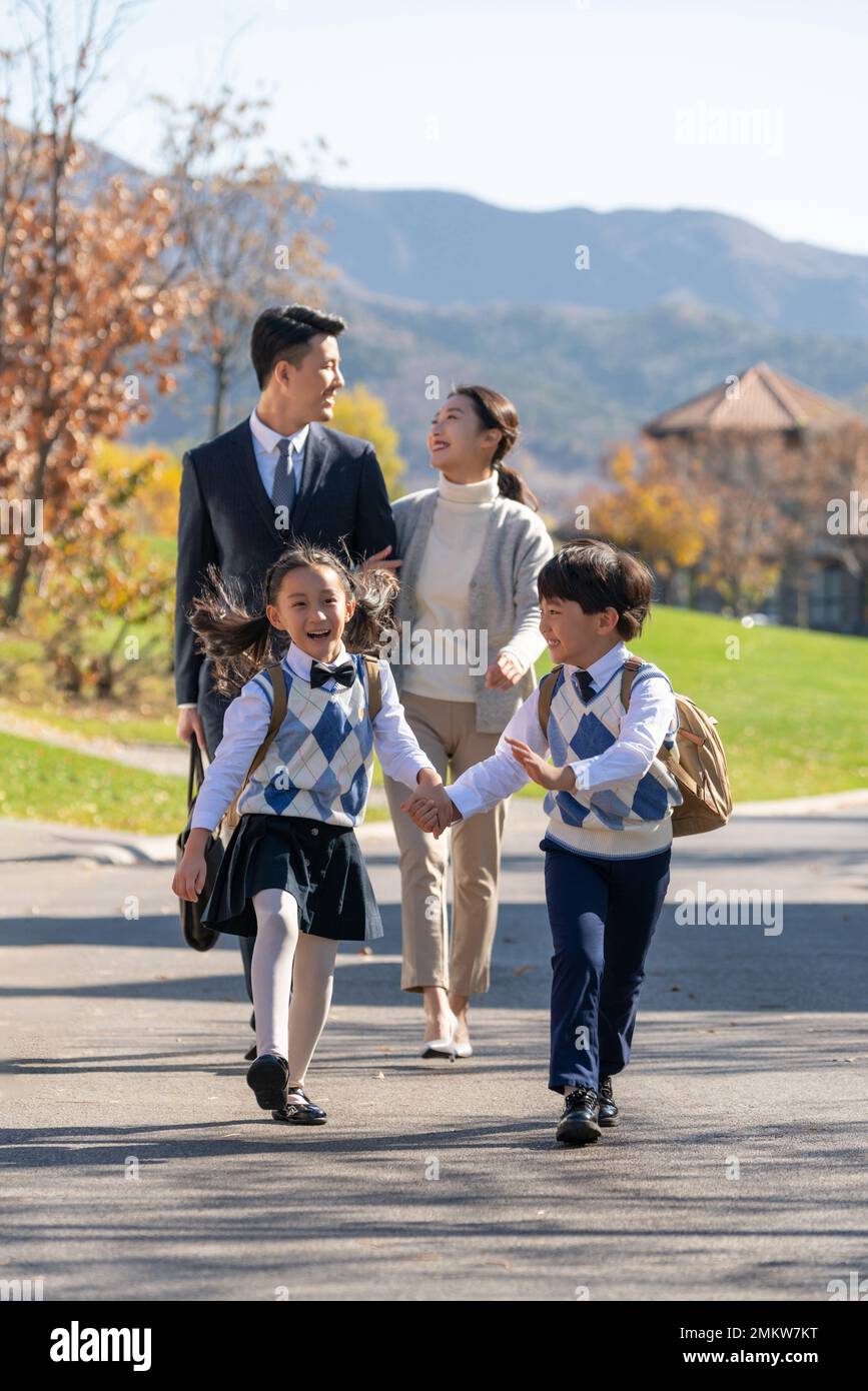 A young couple to send their children to school Stock Photo - Alamy