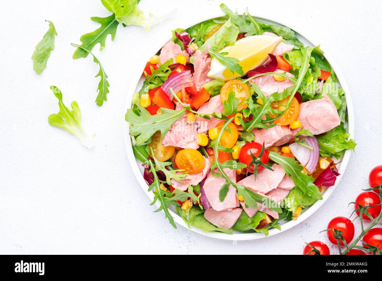 Tuna vegetables salad with colorful cherry tomatoes, red onion, sweet ...