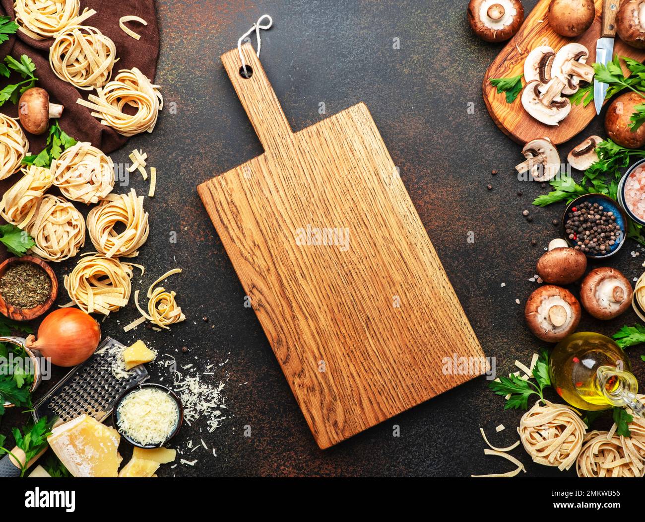 Uncooked pasta, brown champignons mushrooms, vegetables, cheese ...