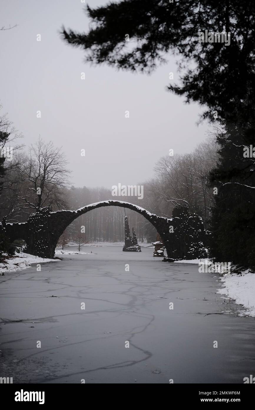 Middle Earth in Winter: An Old Stone Bridge over a Frozen Lake Stock ...