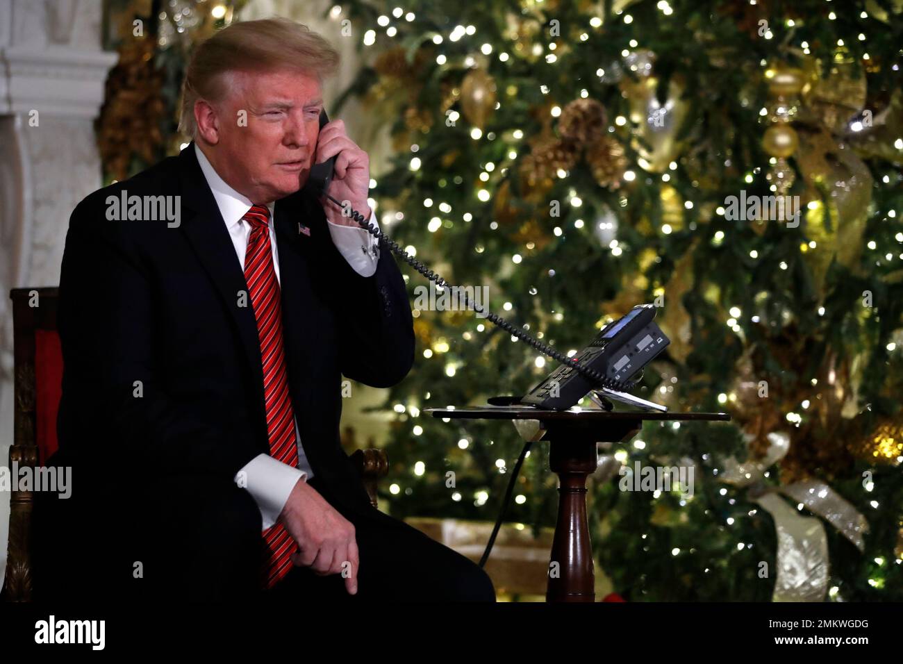 President Donald Trump speaks on the phone sharing updates to track ...