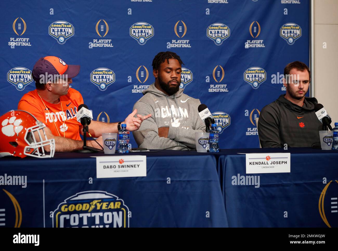 Clemson head coach Dabo Swinney, left, introduces linebacker Kendall ...