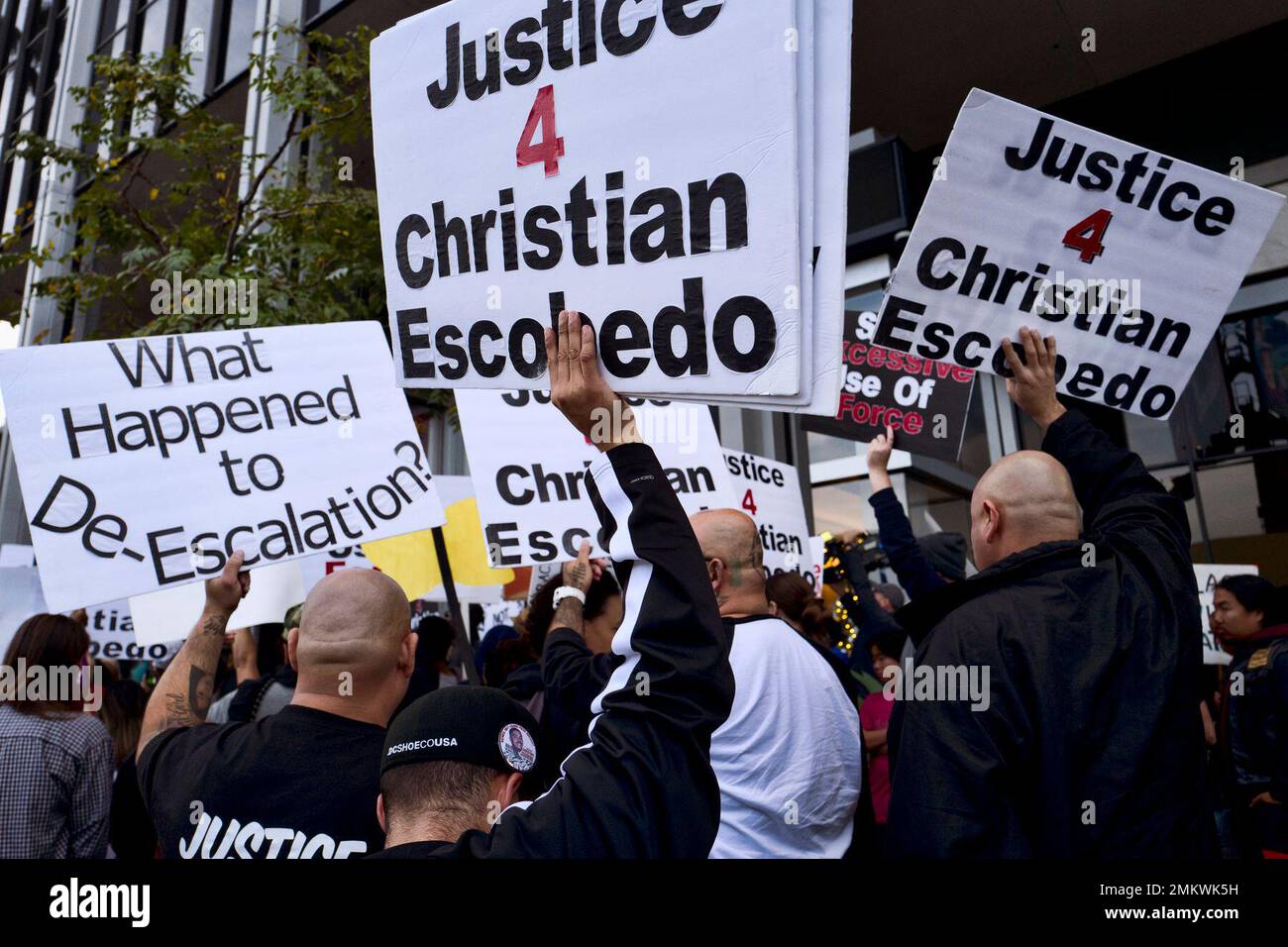 People gathered for Christian Escobedo hold signs during a Black Lives ...
