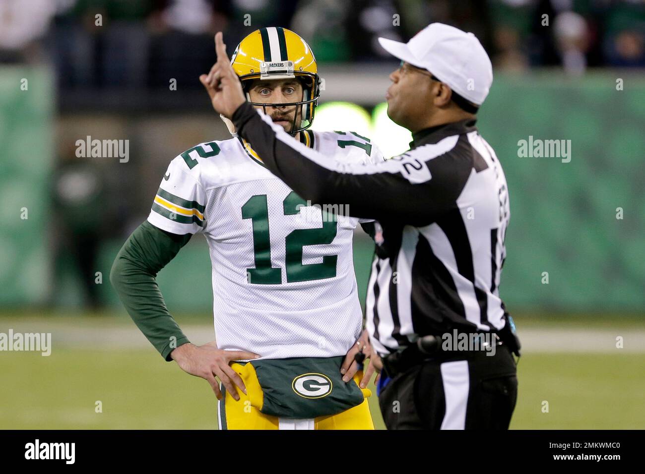 Green Bay Packers quarterback Aaron Rodgers (12) looks on as referee ...