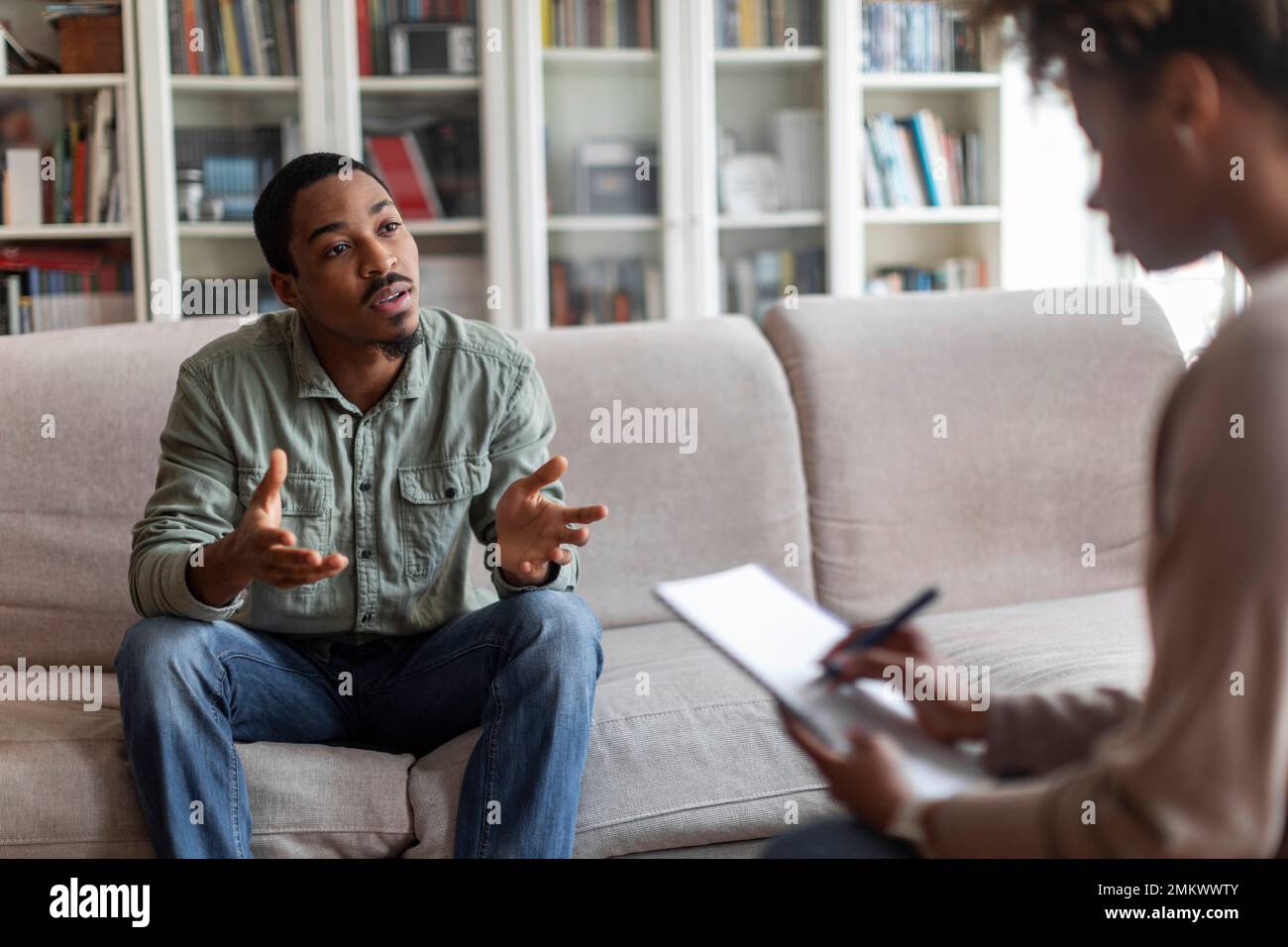 Emotional african american guy attend therapy session with psychologist ...