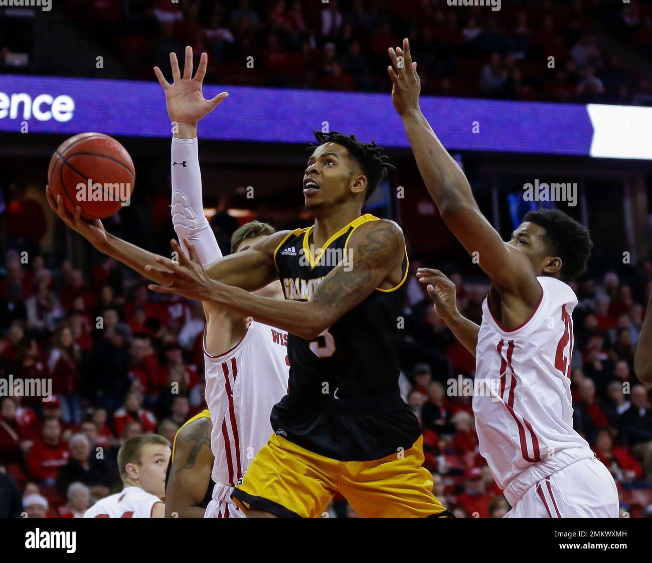 Grambling State's Dallas Polk-Hillard (3) shoots between Wisconsin's ...