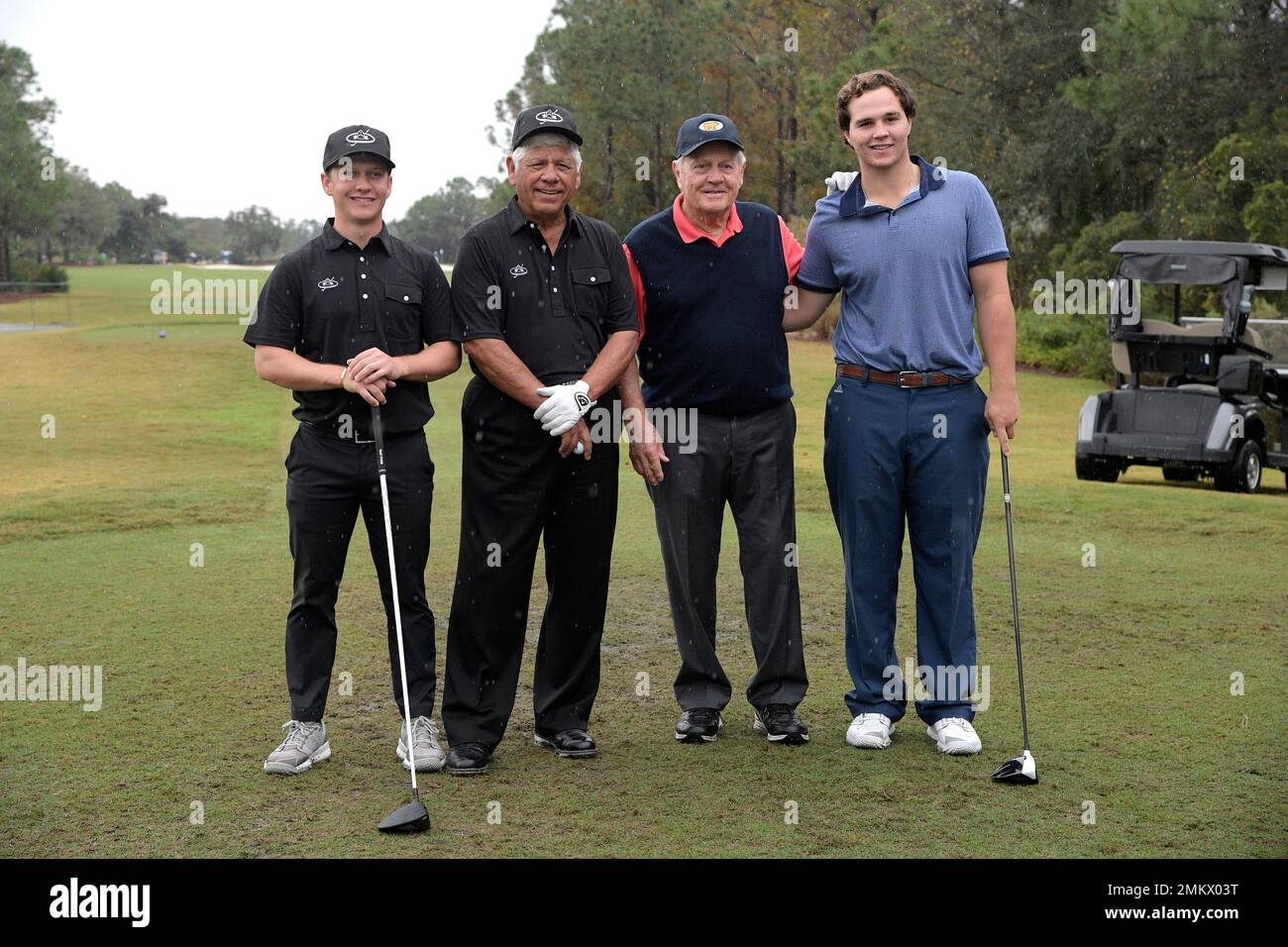 Lee Trevino, second from left, poses with his son, Daniel Trevino, left ...