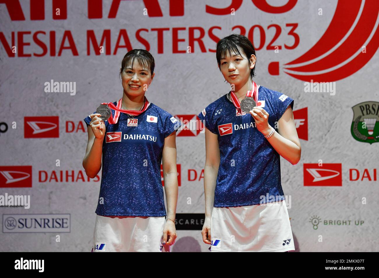 Jakarta, Indonesia. 29th Jan, 2023. Second placed Fukushima Yuki (L)/Hirota Sayaka of Japan pose ...