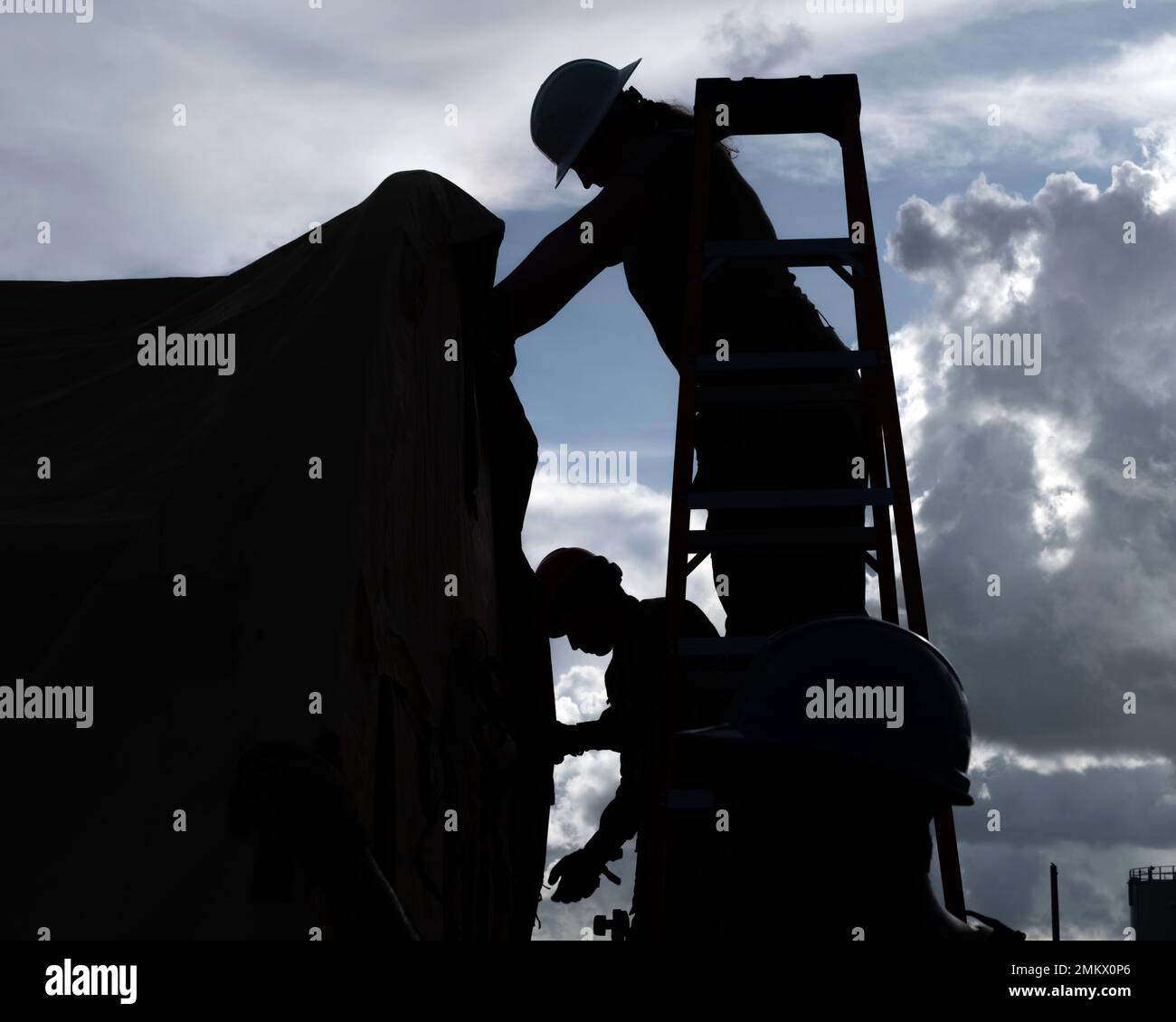 U.S. Air Force Airmen assigned to the 36th Wing assemble a tent during ...