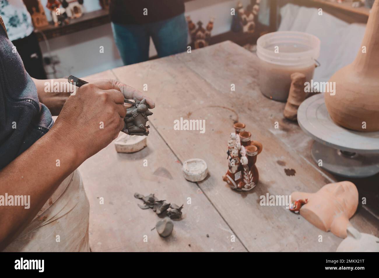 Man molding clay to make ceramics with his hands, Artisan working in ...