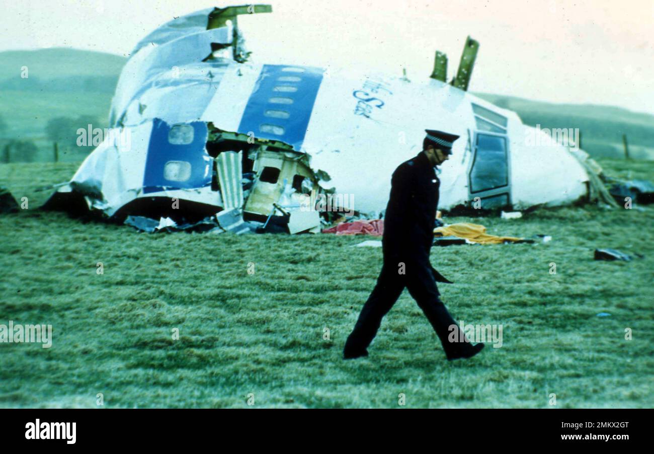 FILE - In this Dec. 1988 file photo, a police officer walks past the ...