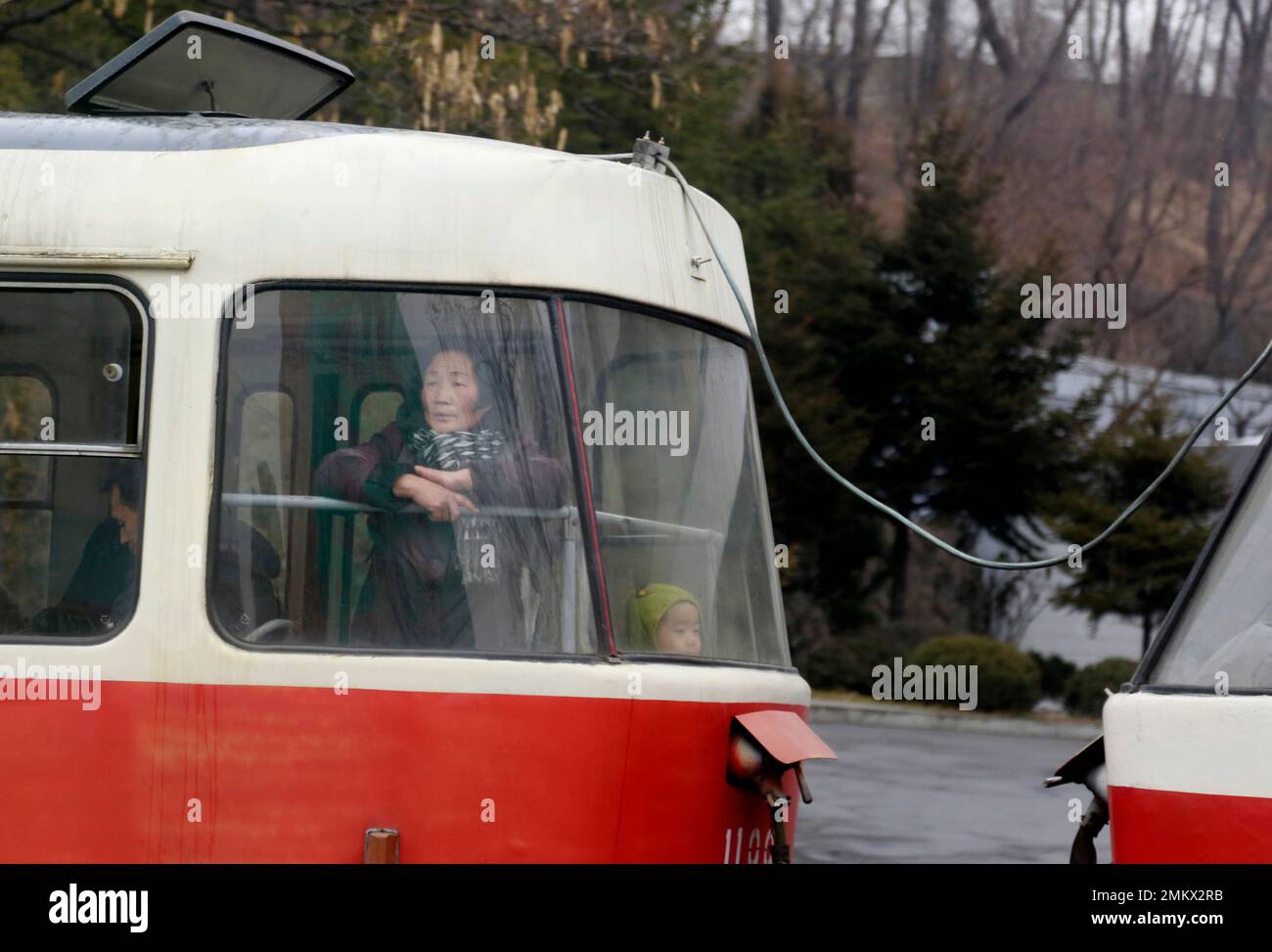 A woman looks out from inside a trolleybus in downtown Pyongyang, North ...