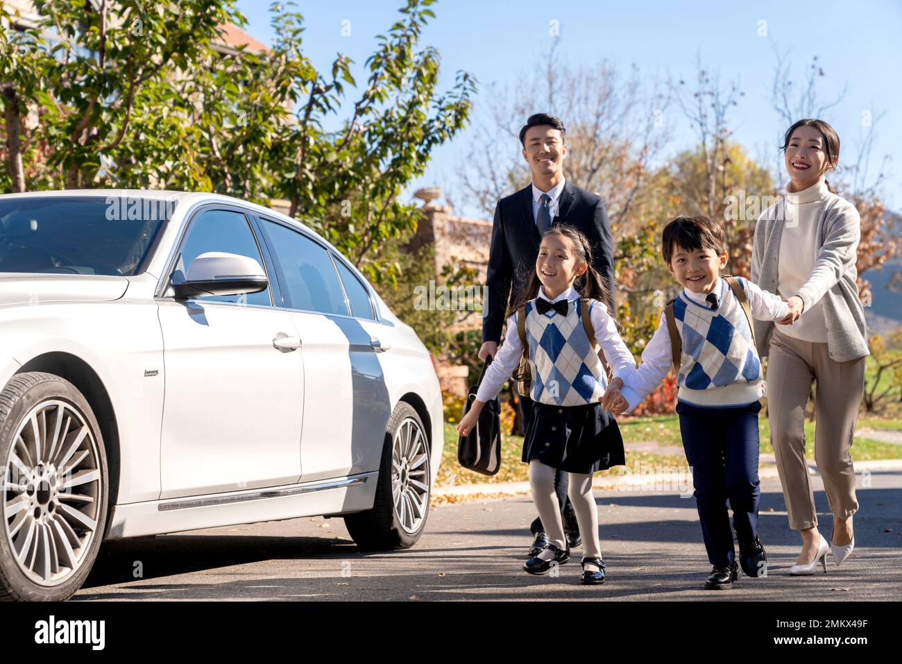 A young couple to send their children to school Stock Photo - Alamy