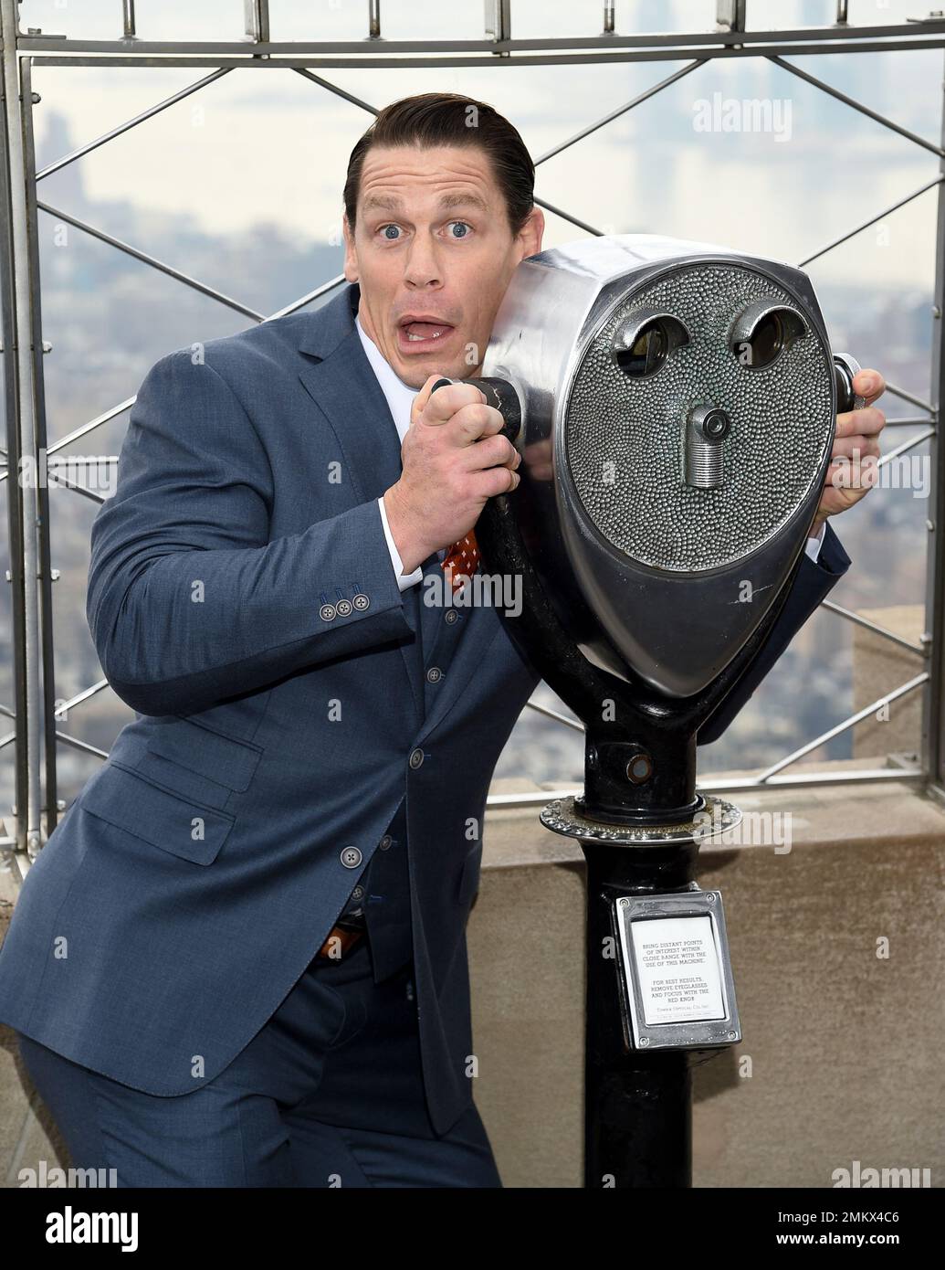 Actor John Cena poses on the 86th floor observation deck at the Empire ...