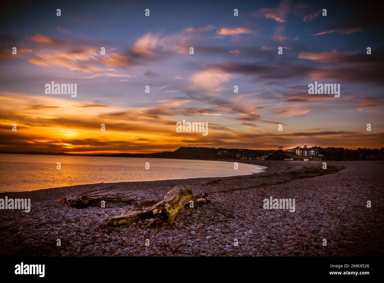 Setting Sun over Budleigh Bay Stock Photo - Alamy