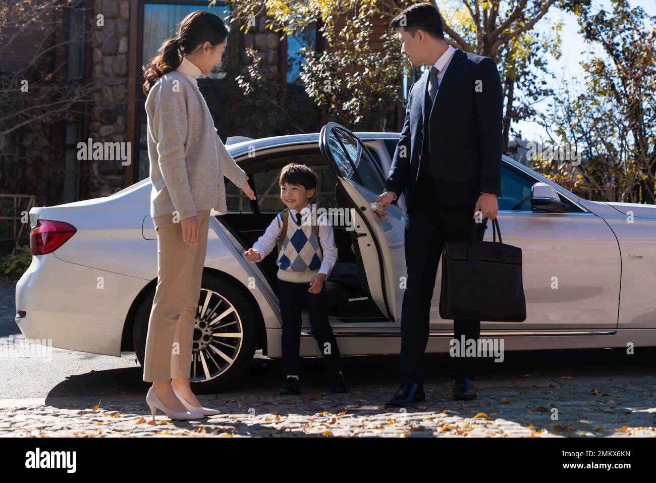 Chinese parents pick up their children from school hi-res stock ...