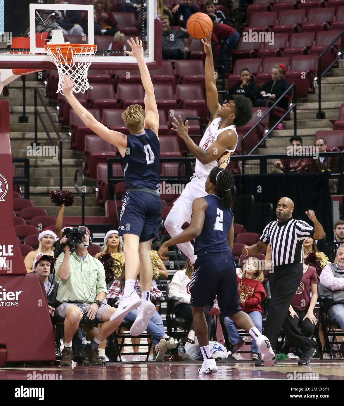 Florida State's Terance Mann shoots over North Florida's Noah Horchler ...