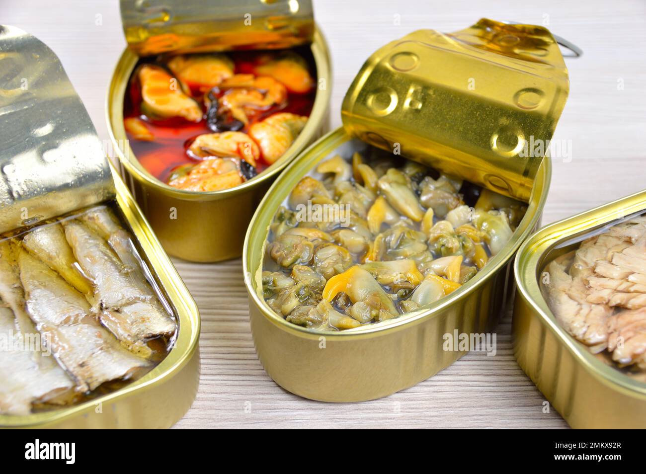 Assortment of cans of canned with different types of fish and seafood ...